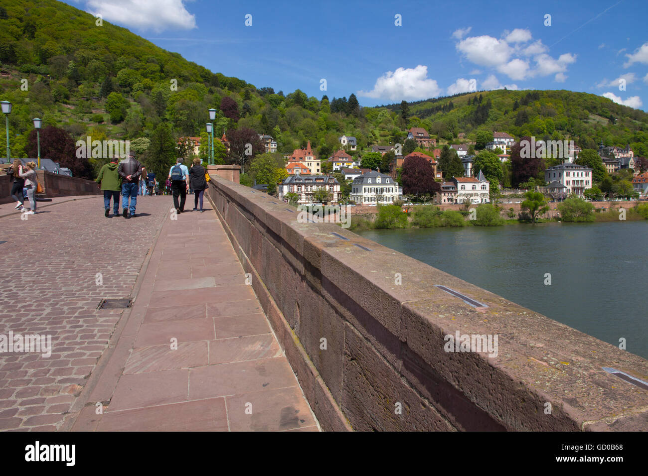 Visitors stroll the Old Bridge (or "Alte Brucke") a classic stone ...