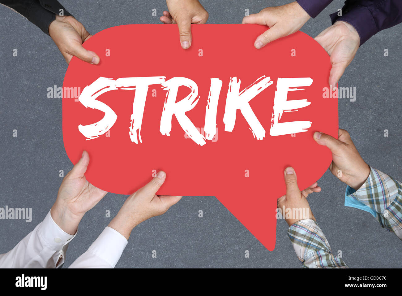 Group of people holding with hands the word strike protest action ...