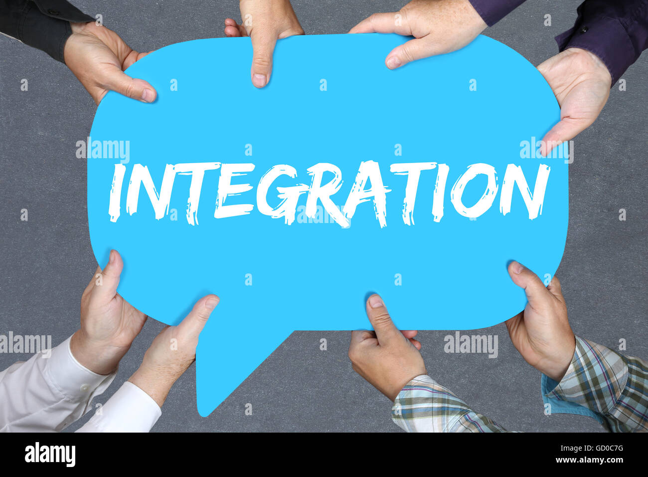 Group of people holding with hands the word integration immigrants ...