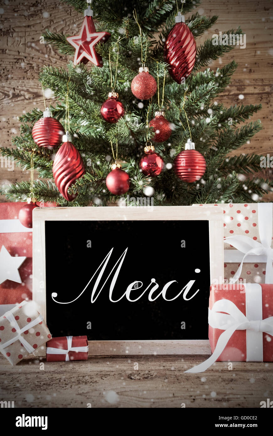 Nostalgic Christmas Tree With Merci Means Thank You Stock Photo - Alamy
