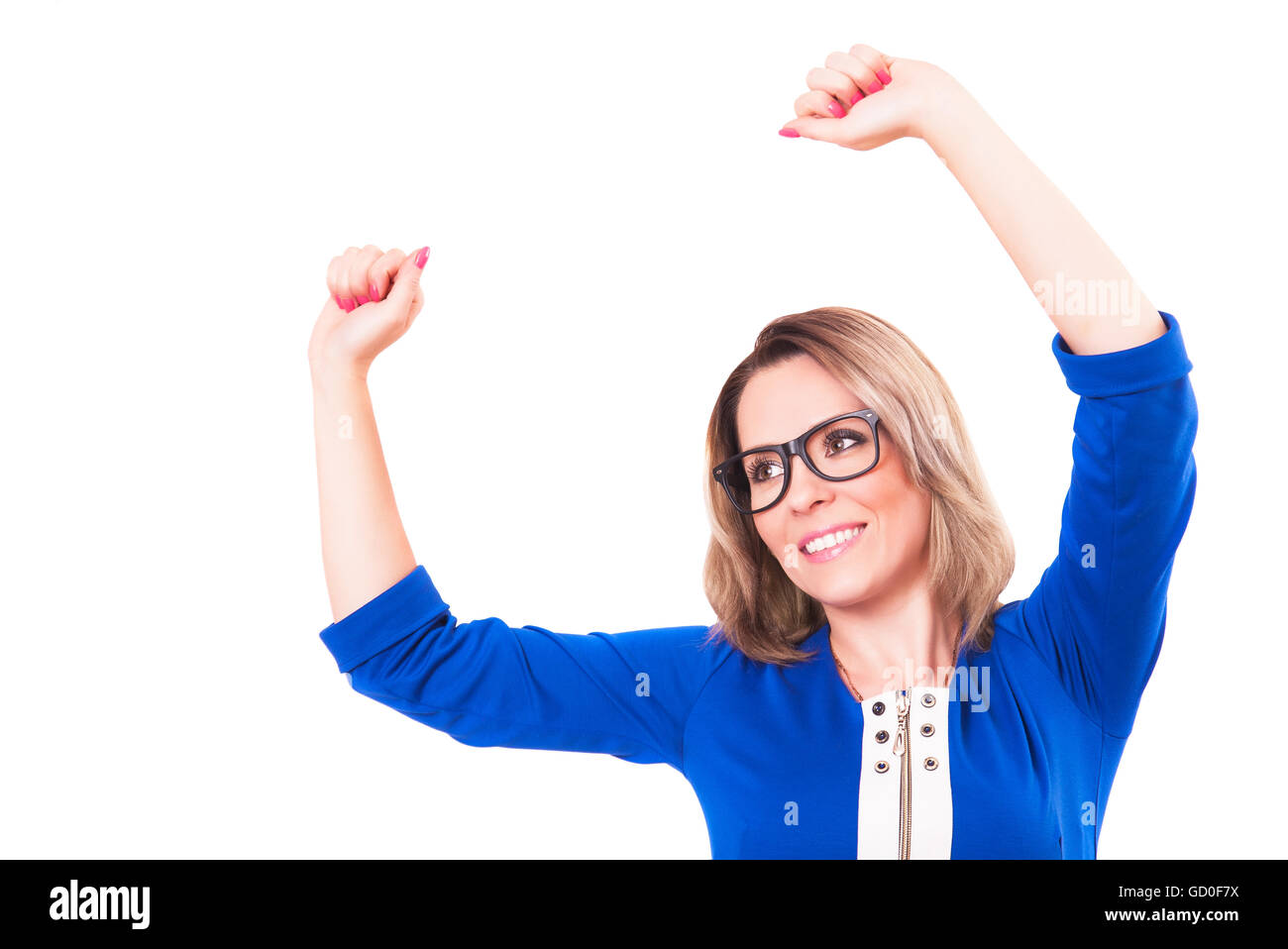 Happy woman in a blue dress hands up isolated on white background in ...