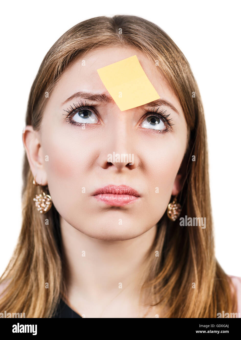 Confused woman with a sticker on her forehead Stock Photo - Alamy
