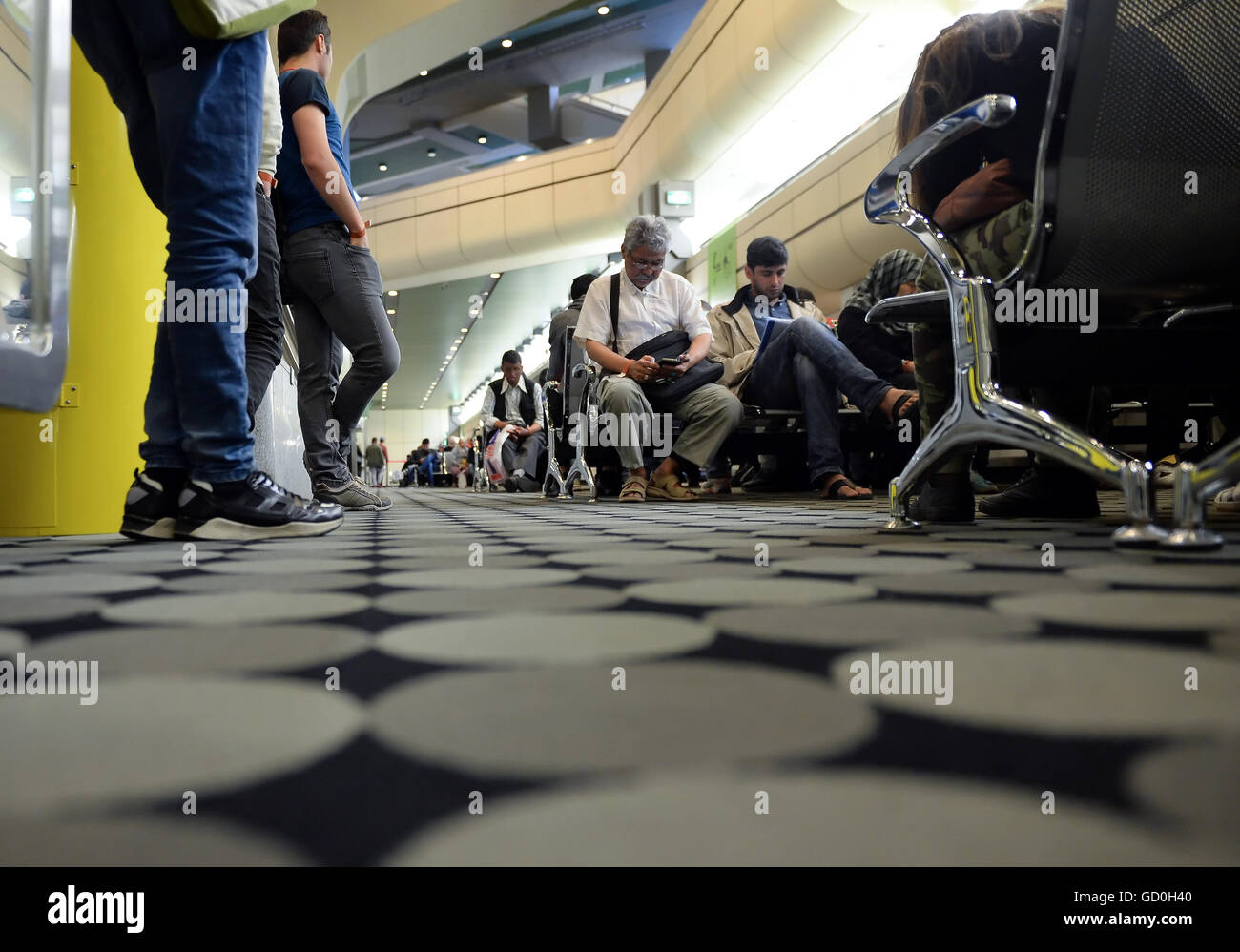 Berlin, Germany. 06th July, 2016. Refugees wait at the service point in ...