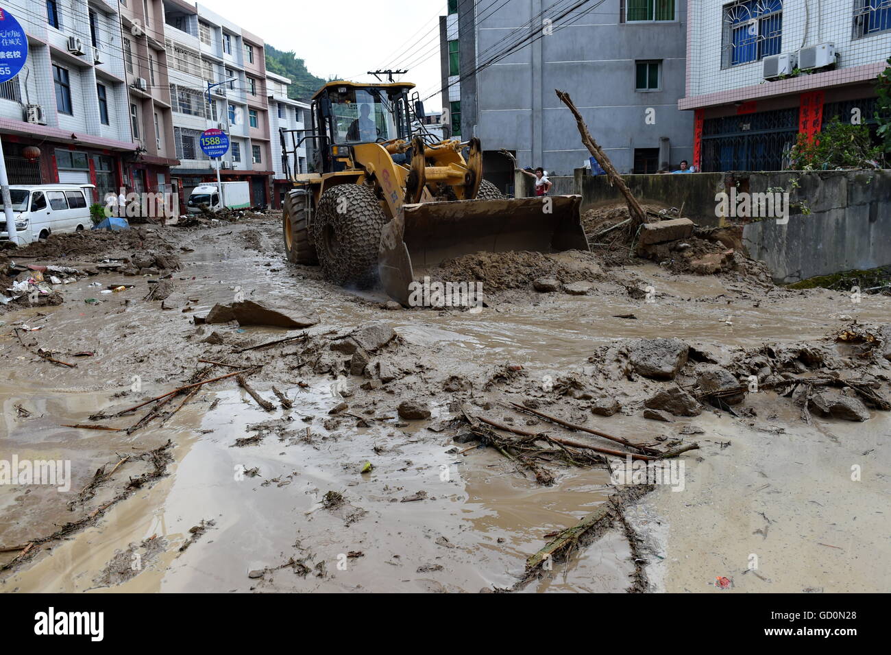 Minqing, China's Fujian Province. 10th July, 2016. A truck clears silt ...