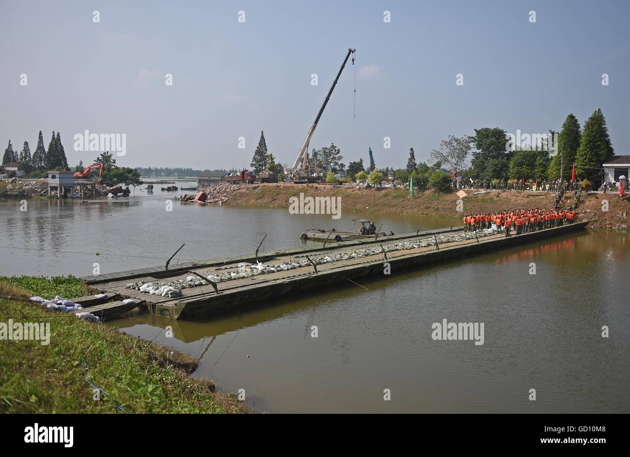 Huarong, China's Hunan Province. 11th July, 2016. A floating bridge is ...