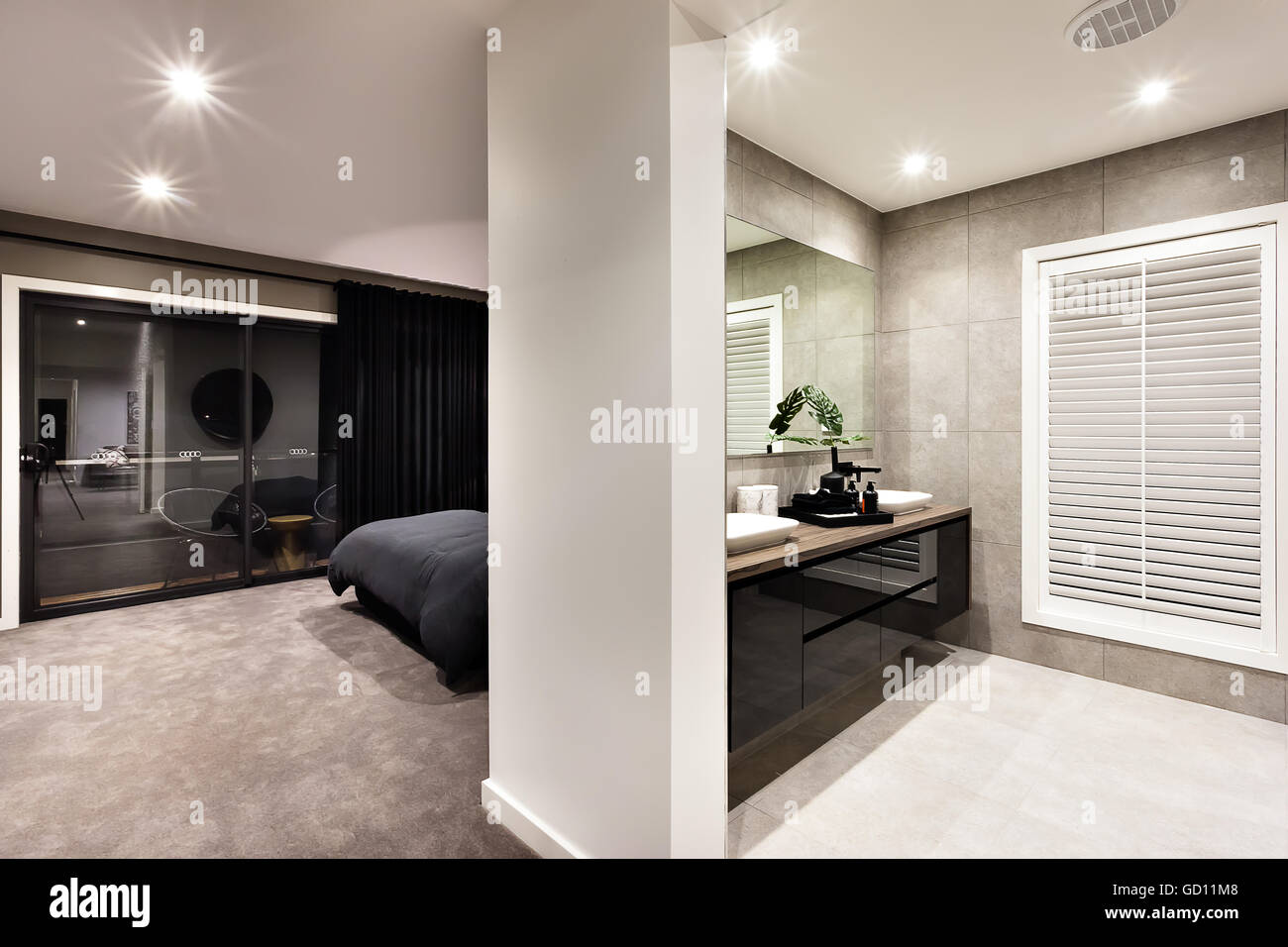 Modern washroom with a window and hallway attached to a glass door ...