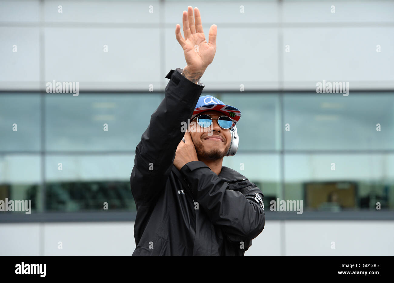 Mercedes' Lewis Hamilton waves to the Silverstone crowd during the ...