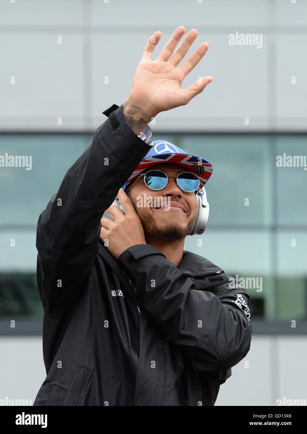 Mercedes' Lewis Hamilton waves to the Silverstone crowd during the ...