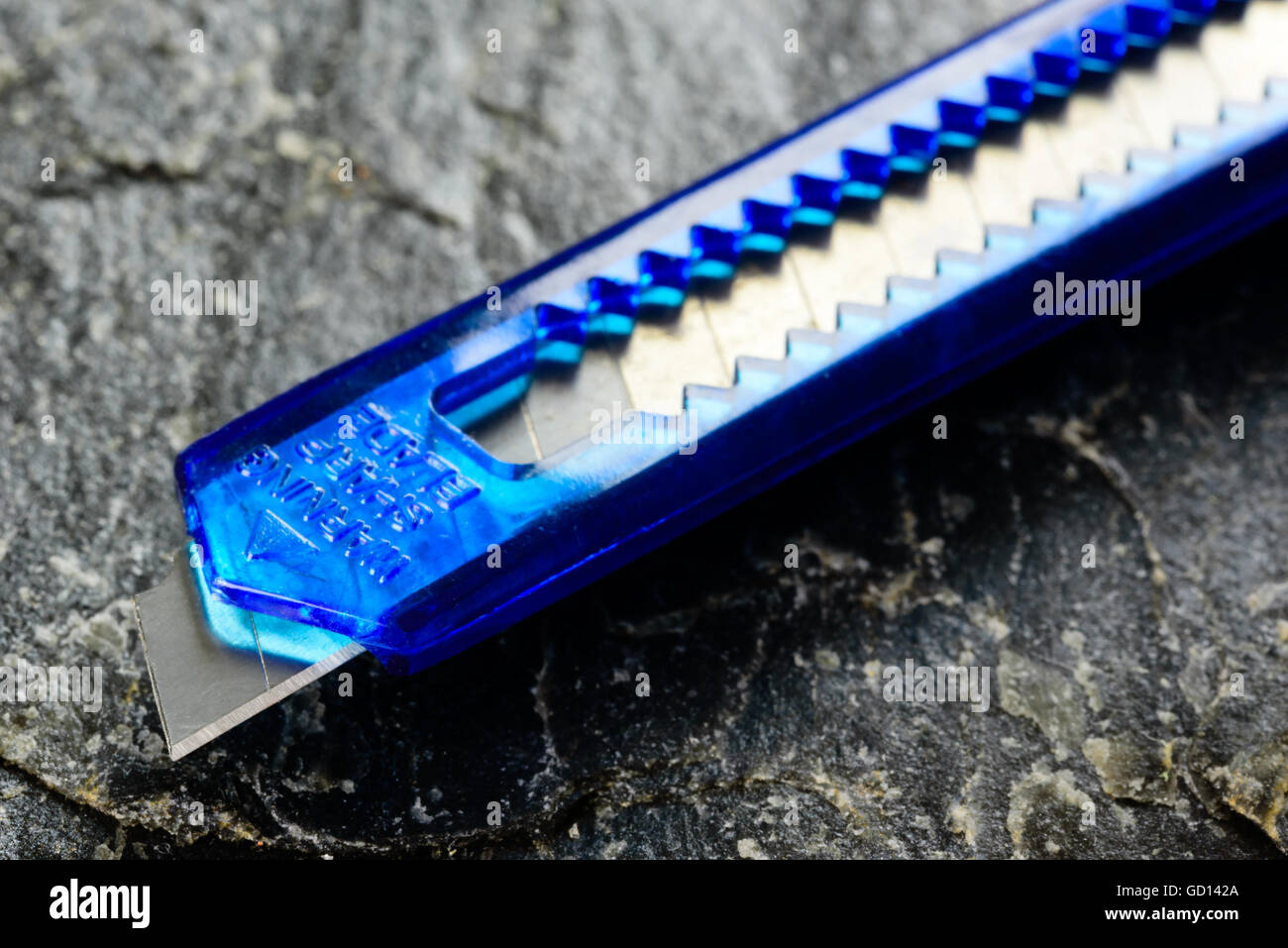 Front end of a blue plastic segmented utility knife or snap-off blade ...