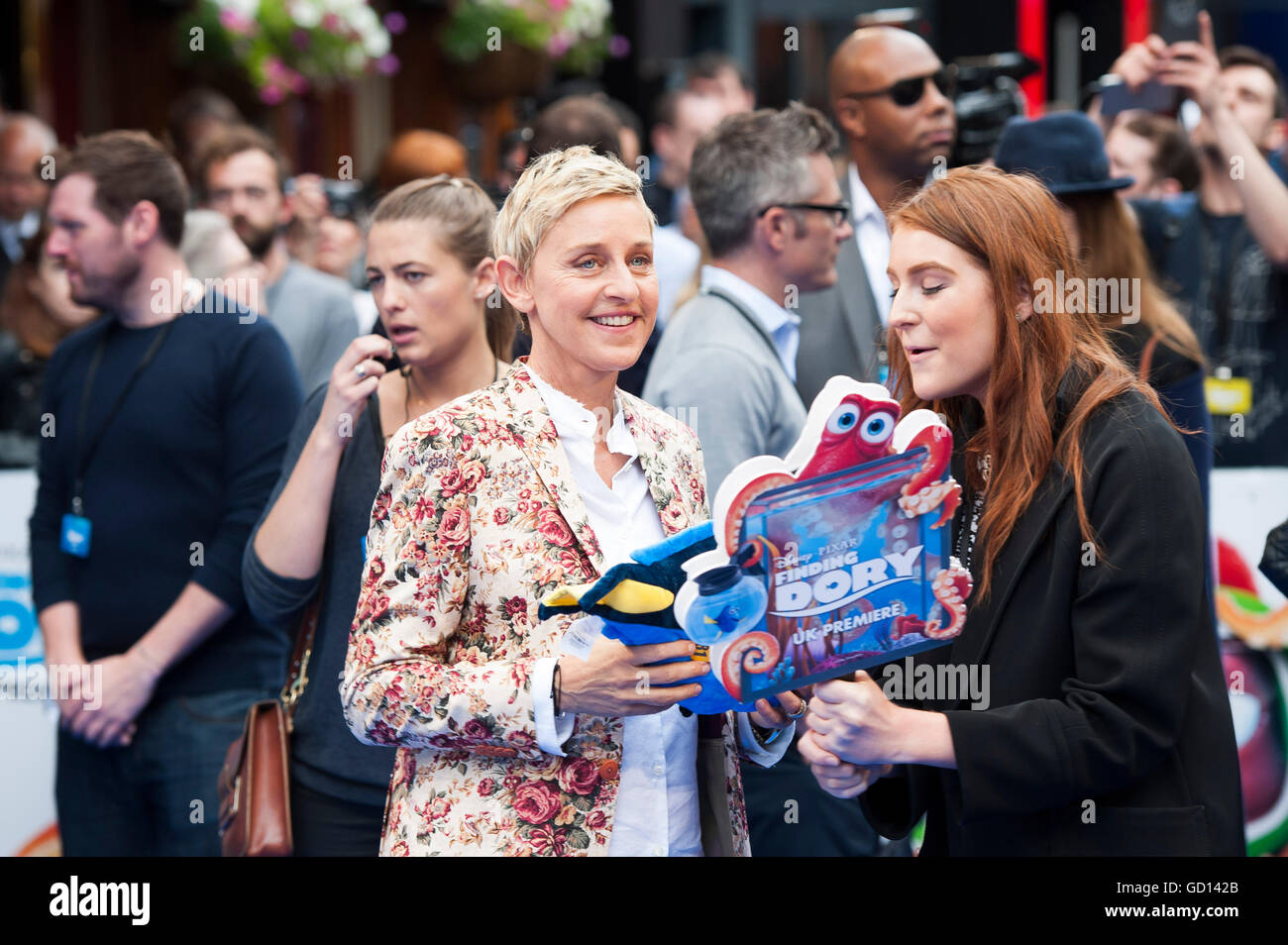 Ellen DeGeneres (centre) holds a toy Dory at the UK premiere of Finding ...