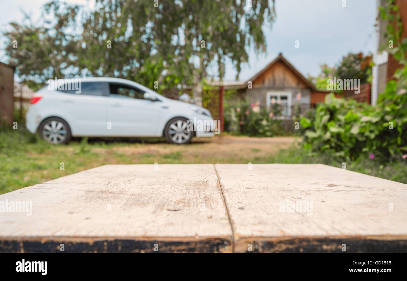 New car parked outside next to countryside house. Defocused image Stock ...