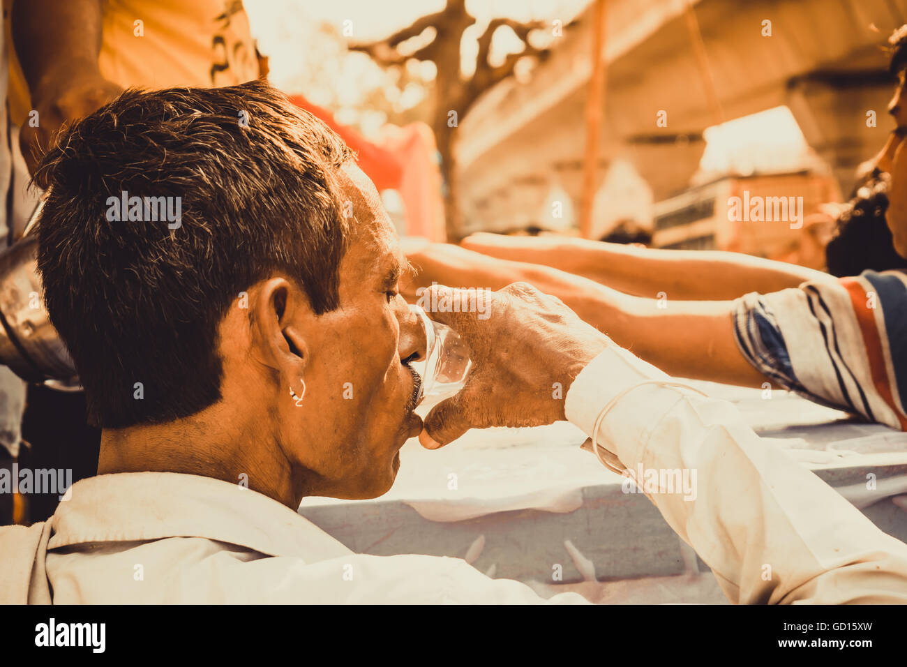 Indian Village man drinks water in hot summer Stock Photo - Alamy
