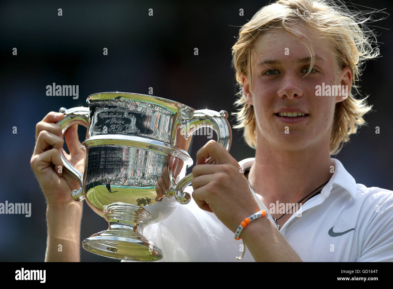 Denis Shapovalov poses with his trophy after winning the Boys Singles ...