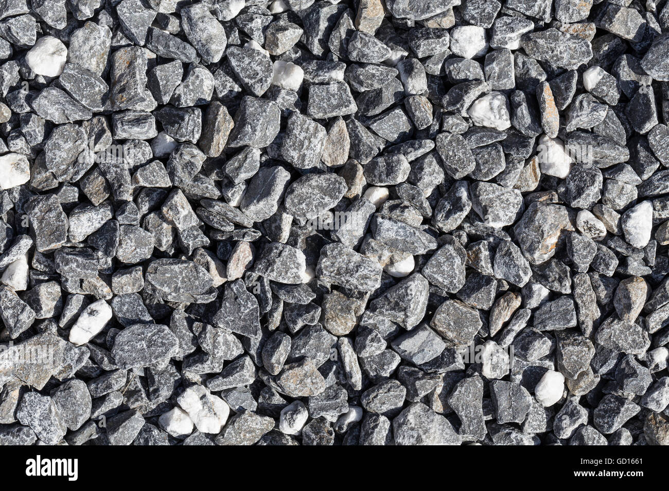 Crushed grey stone on the ground texture background Stock Photo - Alamy