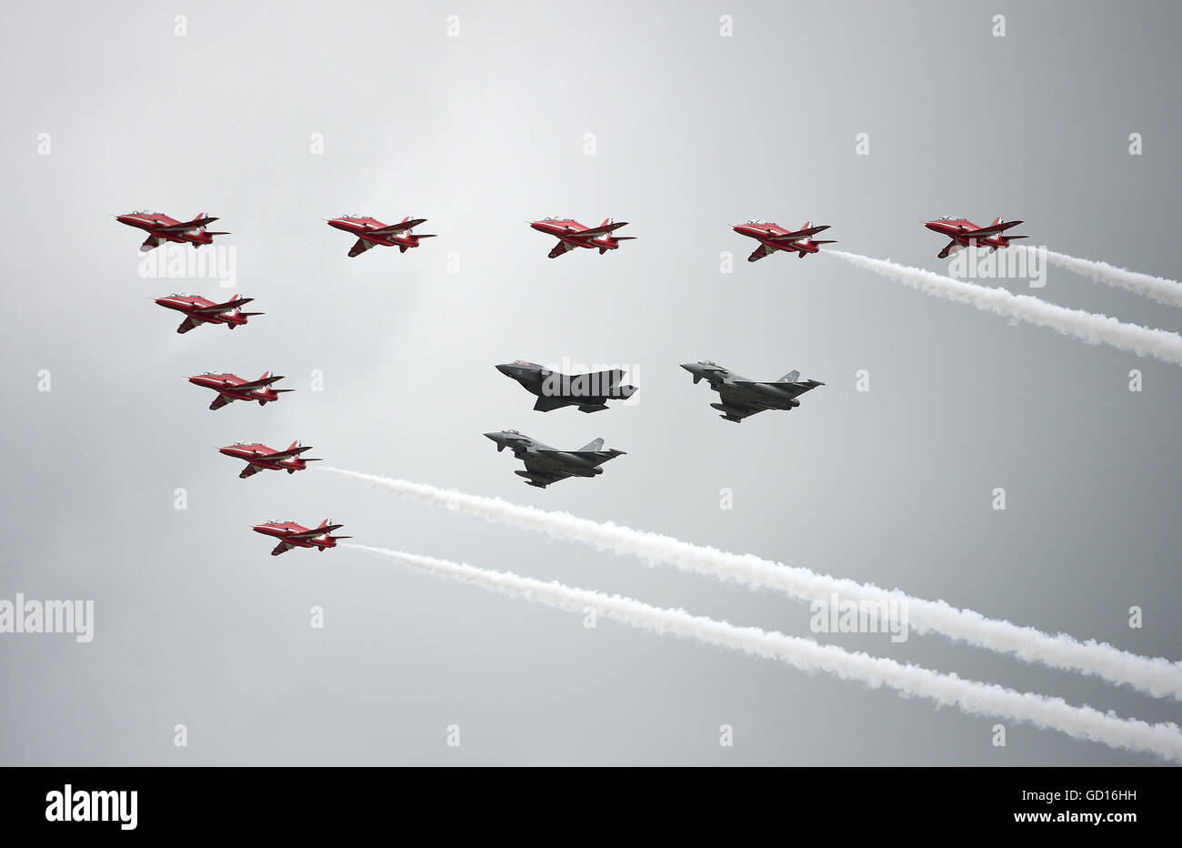 The RAF Red Arrows display team, in formation with two Typhoons and the ...