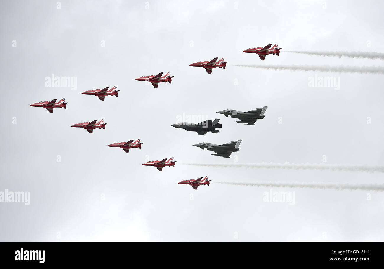 The RAF Red Arrows display team, in formation with two Typhoons and the ...