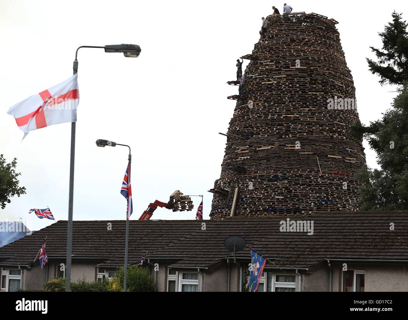 Men construct a bonfire in the Ballymacash area of Lisburn, as building ...