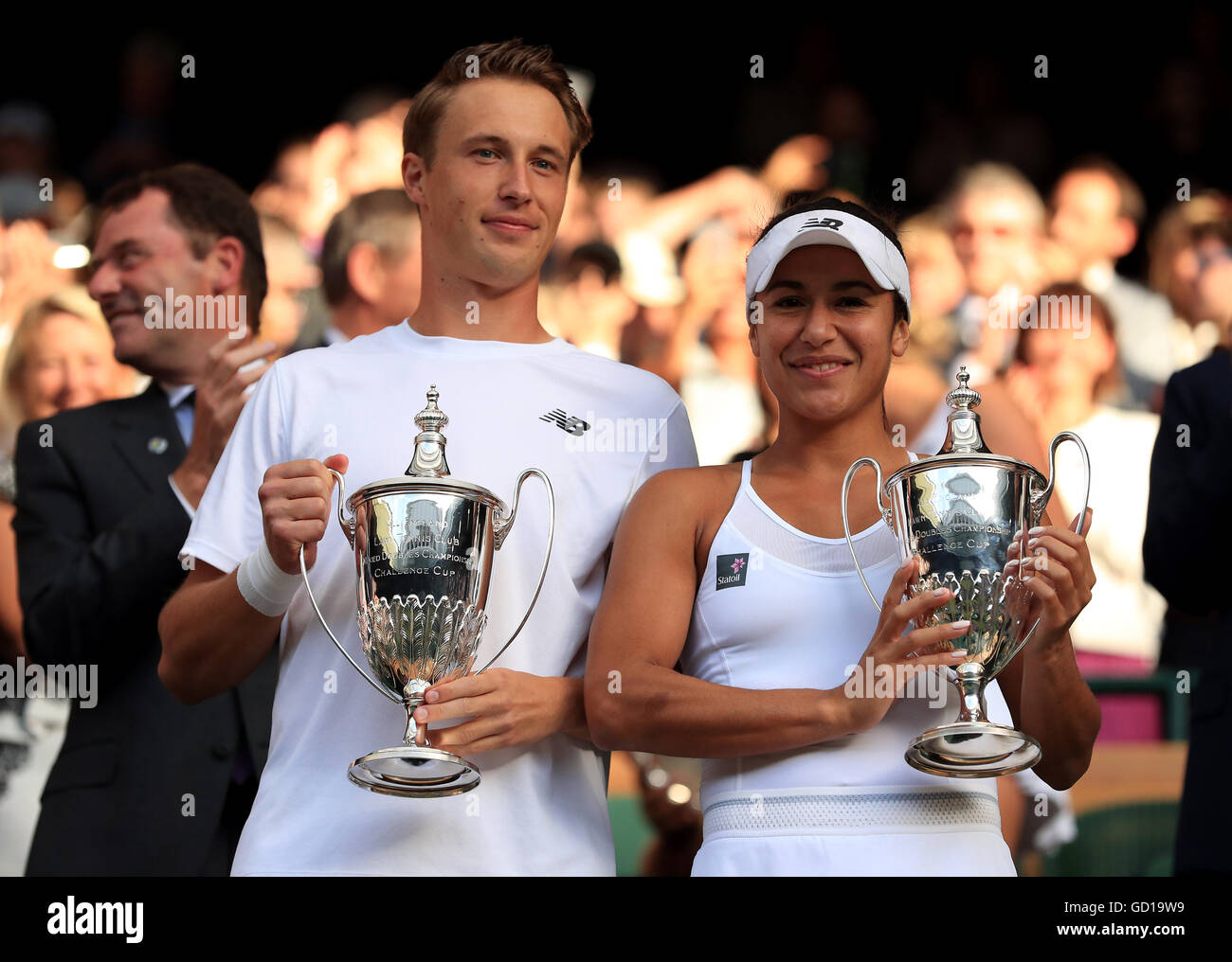 Heather Watson and partner Henri Kontinen with their trophies after ...