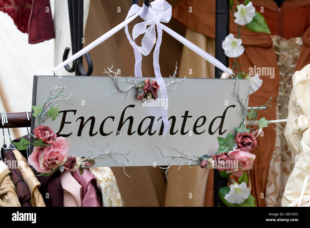 Enchanted sign tied with ribbon Stock Photo - Alamy