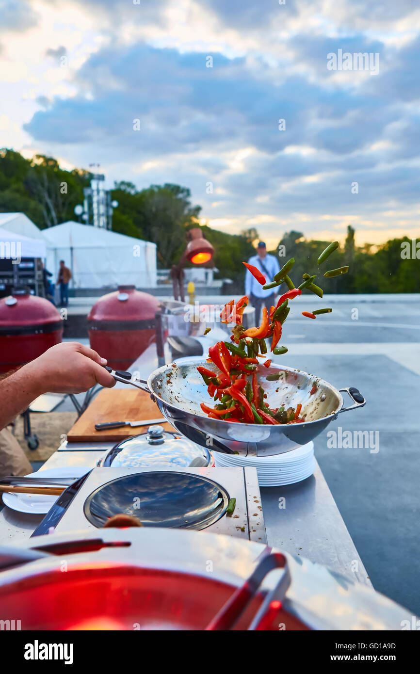 chef tossing vegetables in a wok Stock Photo - Alamy