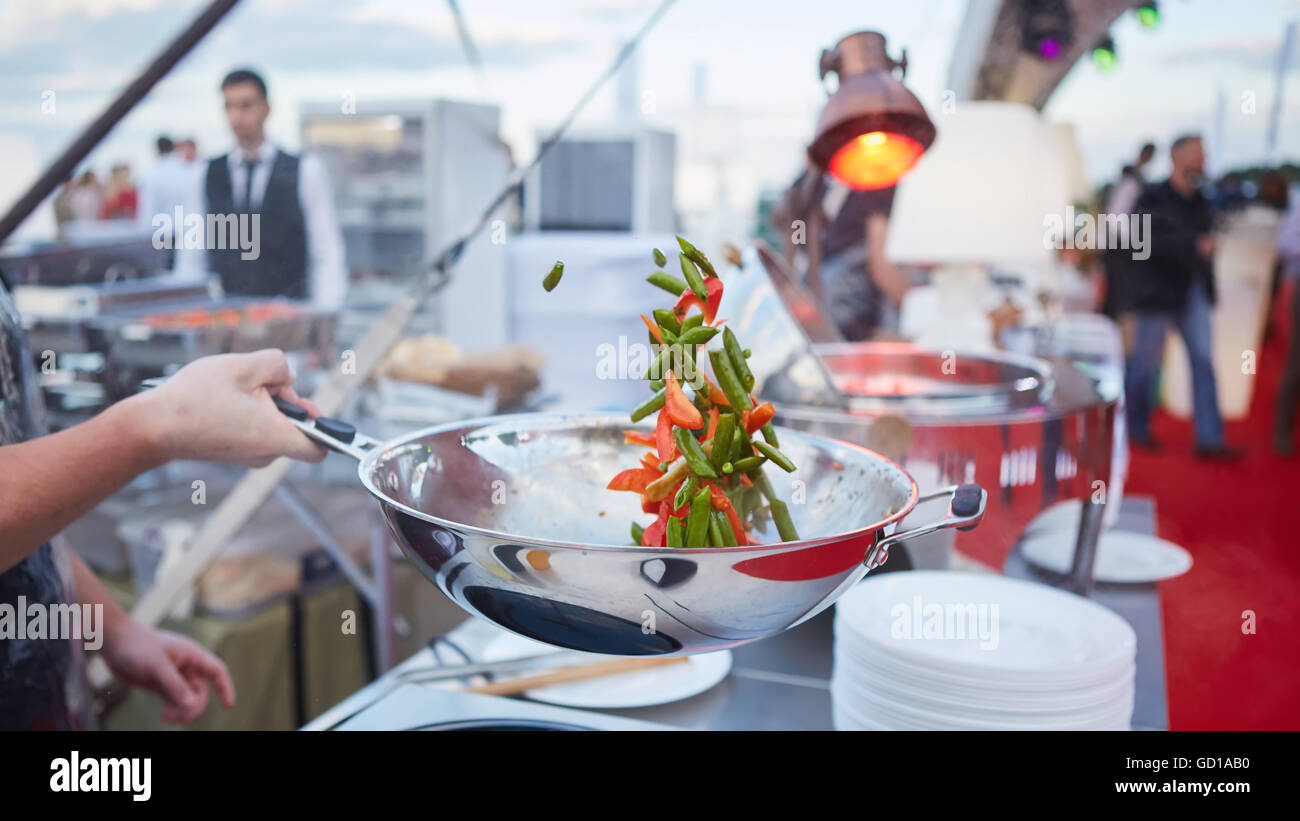 chef tossing vegetables in a wok Stock Photo - Alamy