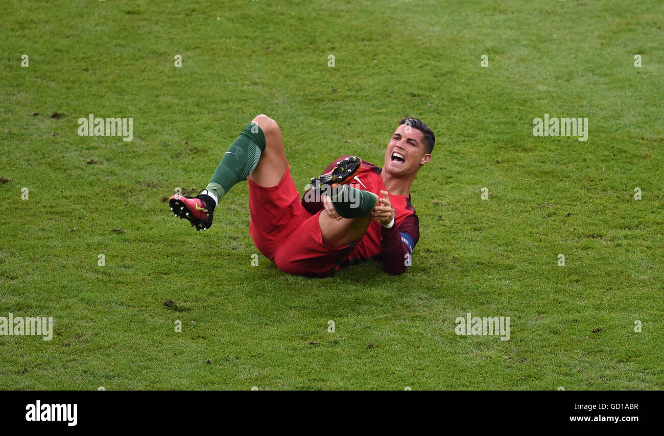 Portugal's Cristiano Ronaldo lies injured during the UEFA Euro 2016 ...