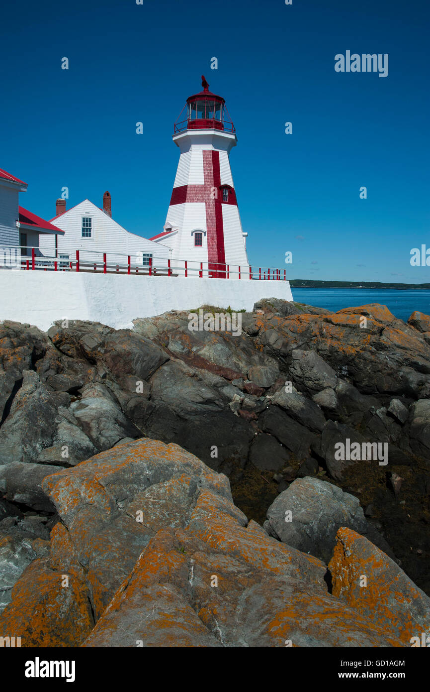 Head Harbor lighthouse, with its unique red cross painted on the tower ...