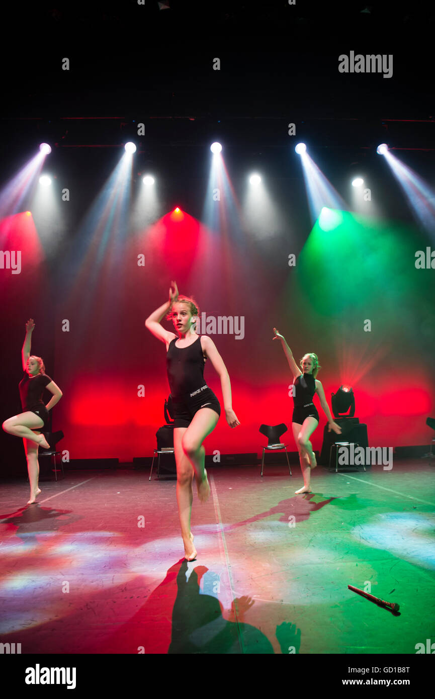 A group of teenage girl dancers performing in a showcase of ...