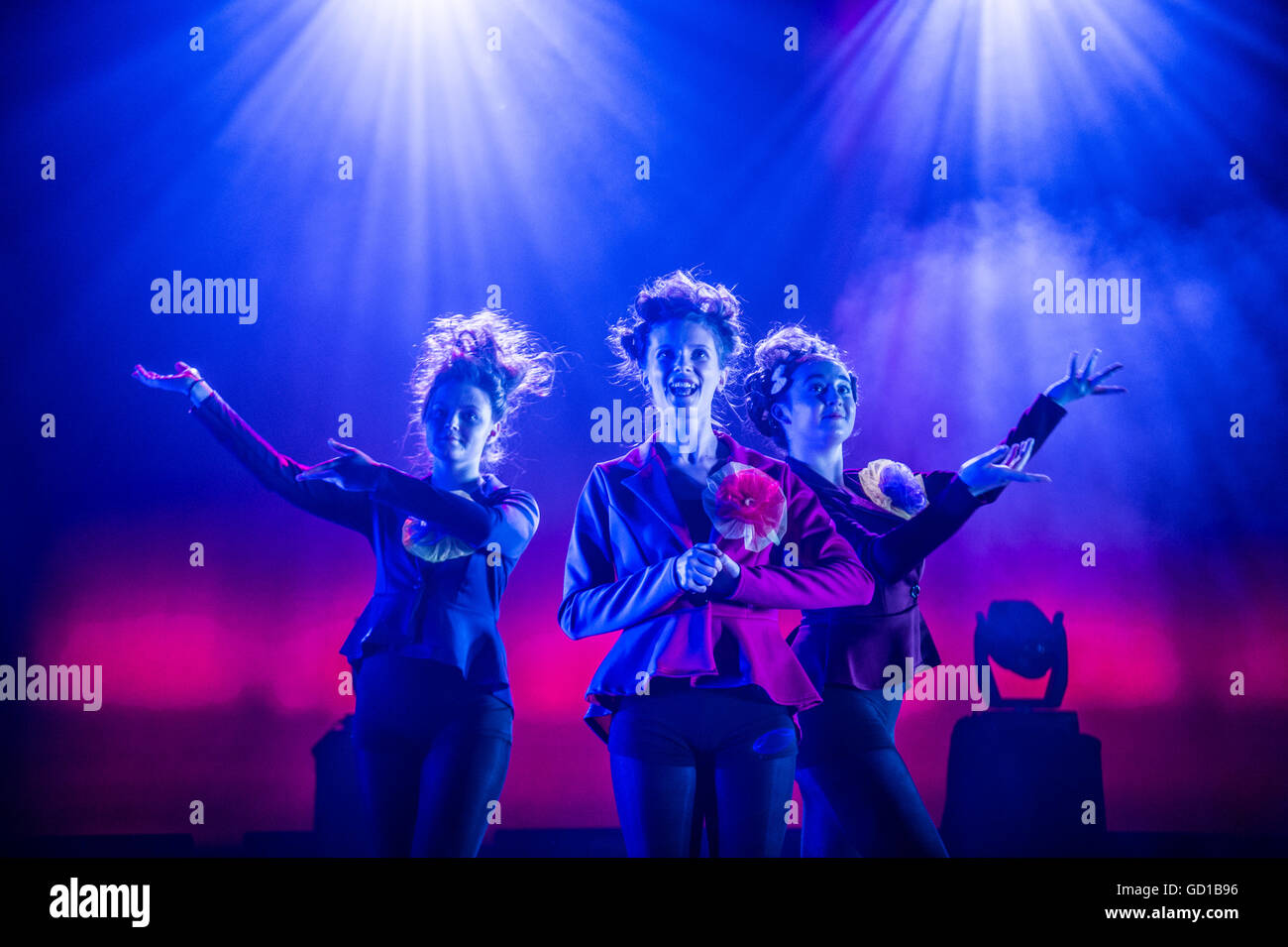 A group of teenage girl dancers performing in a showcase of ...