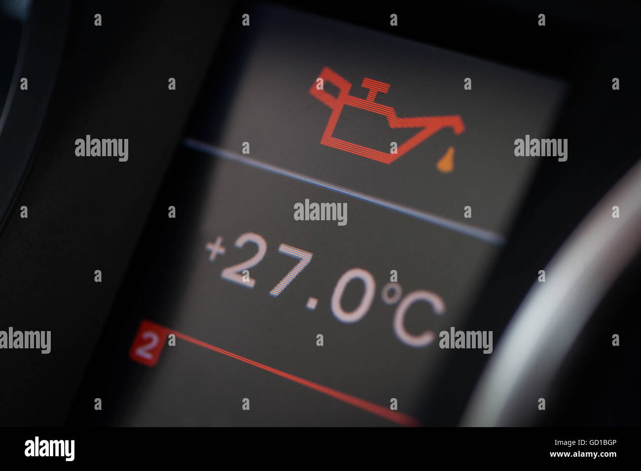 Detail of the dashboard of a car, with the oil alert icon lit up Stock ...