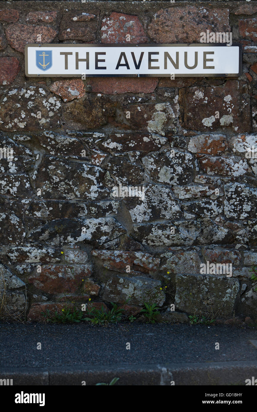 Color image of a street name placard on a wall Stock Photo - Alamy