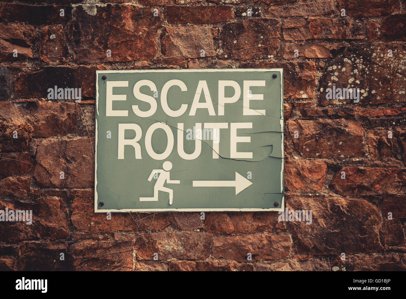 Color image of an Escape Route indicator on a brick wall Stock Photo ...