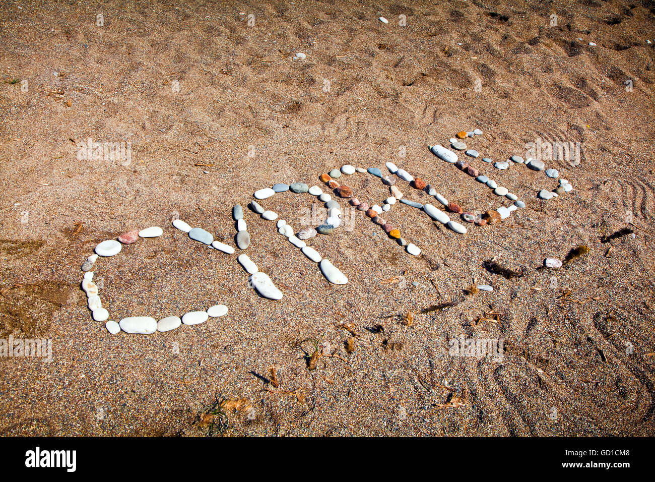 Sign Cyprus on the sand Stock Photo - Alamy