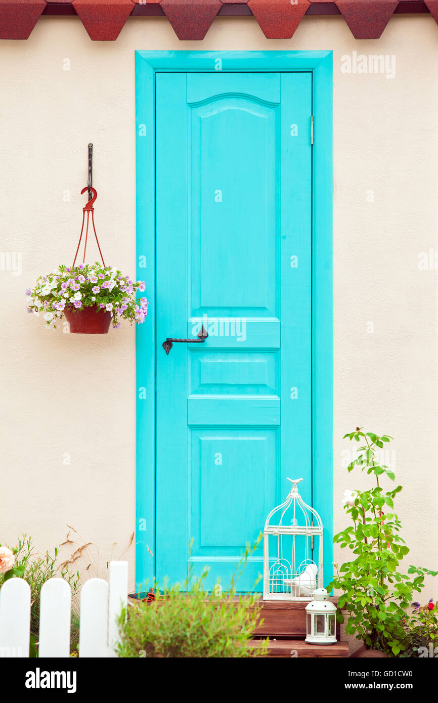 Aqua color door entrance to the house Stock Photo - Alamy