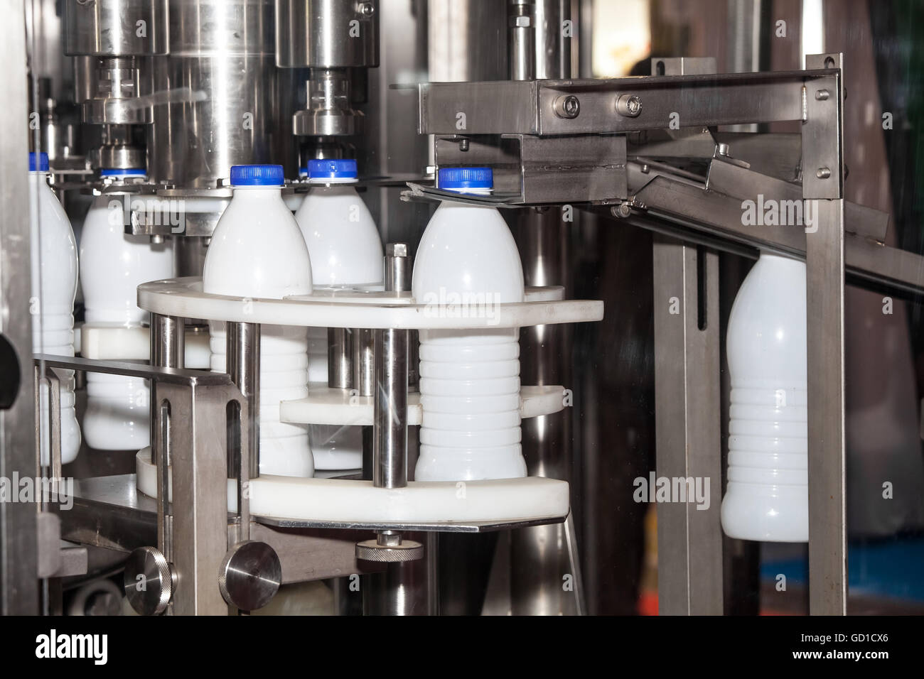 Packaging milk bottles line Stock Photo - Alamy