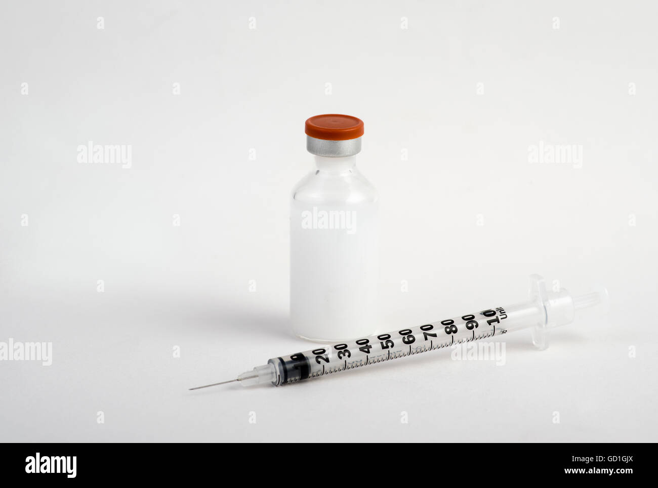 Insulin and syringe against a white background Stock Photo - Alamy
