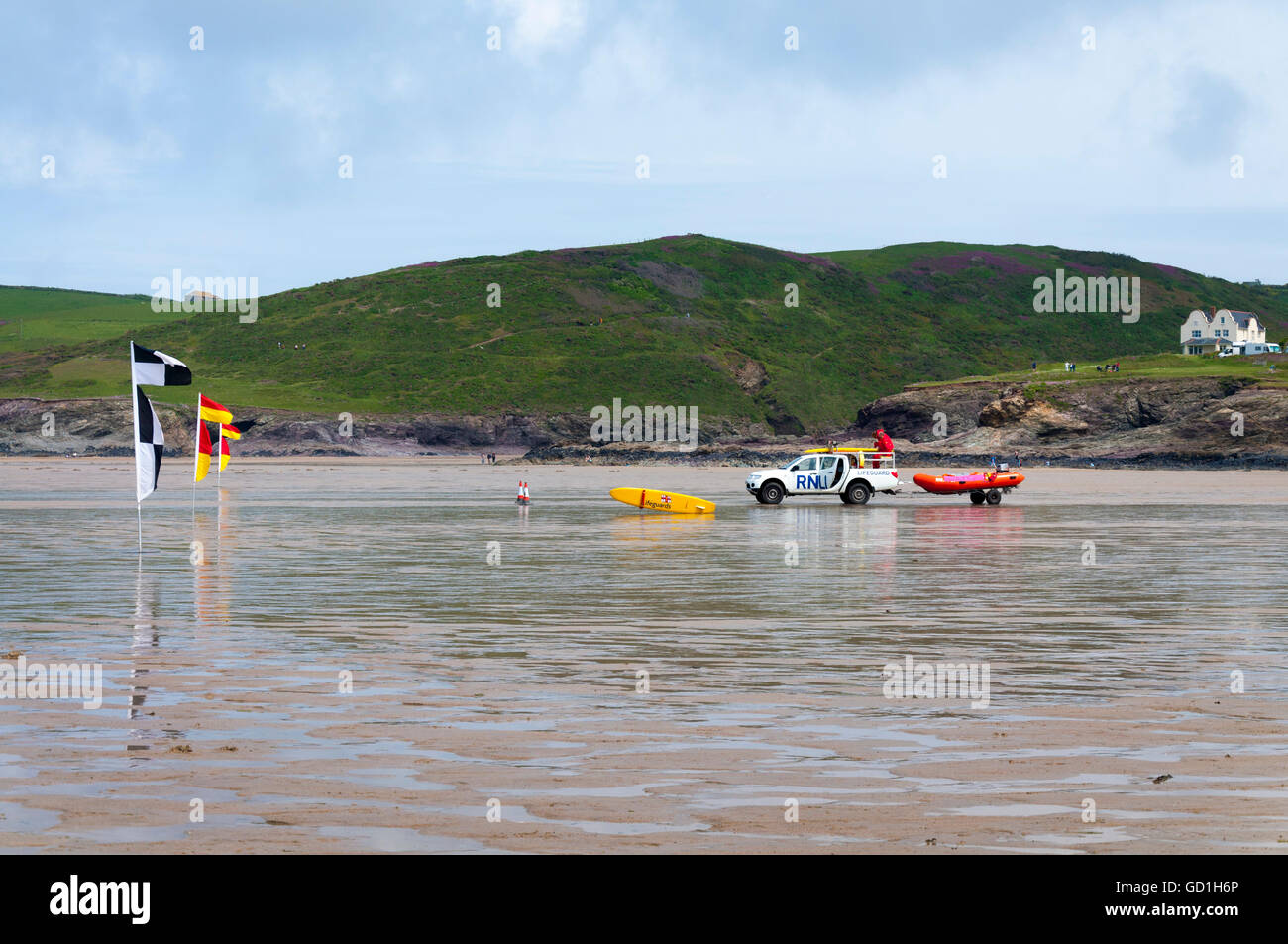 Lifeguards RNLI and safety flags on Polzeath beach, Cornwall, England ...