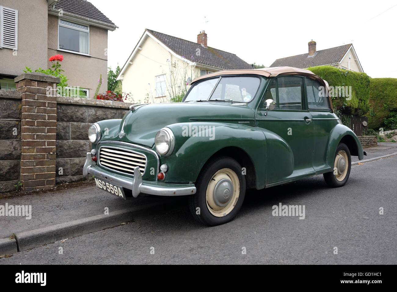 A green Morris Minor Convertible, soft top vintage classic car on the ...