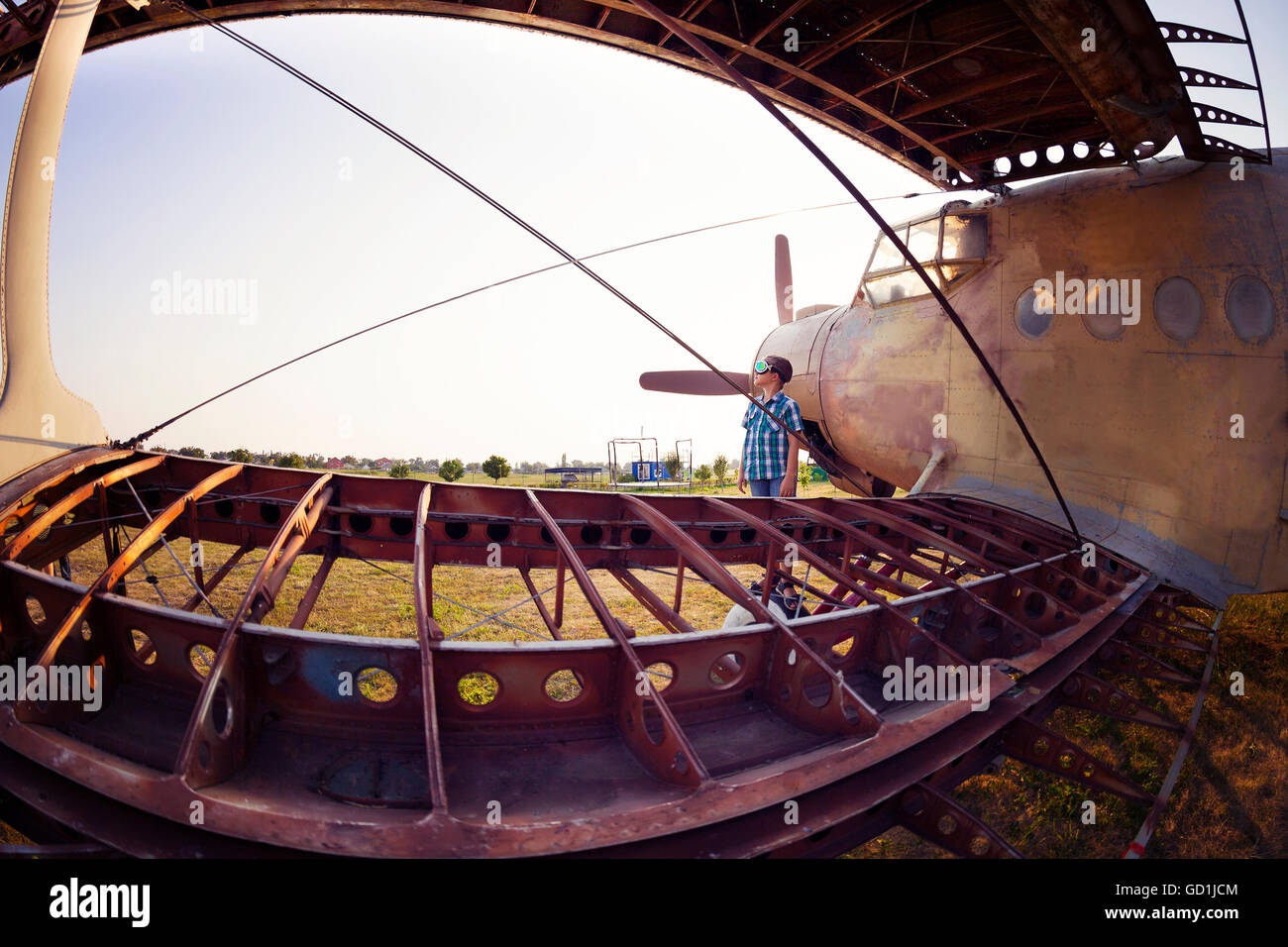 Little boy pilot near the vintage airplane at the airport Stock Photo ...