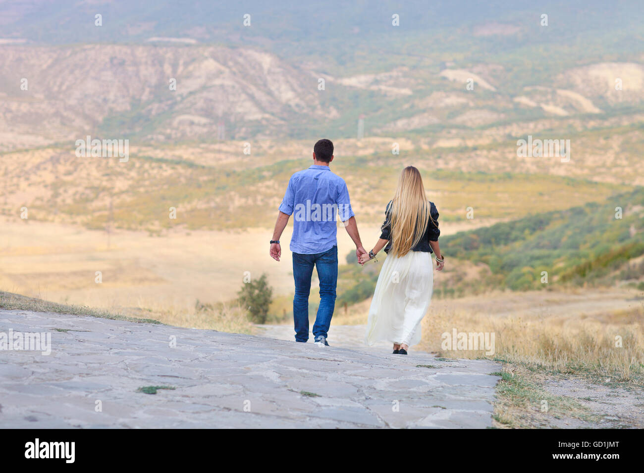 Beautiful happy couple in love walking couple outdoors Stock Photo - Alamy