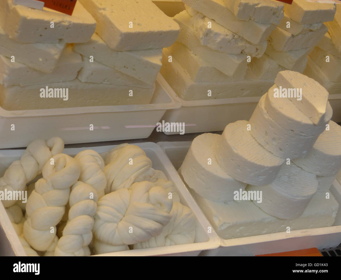 Cheese products in display case Stock Photo - Alamy