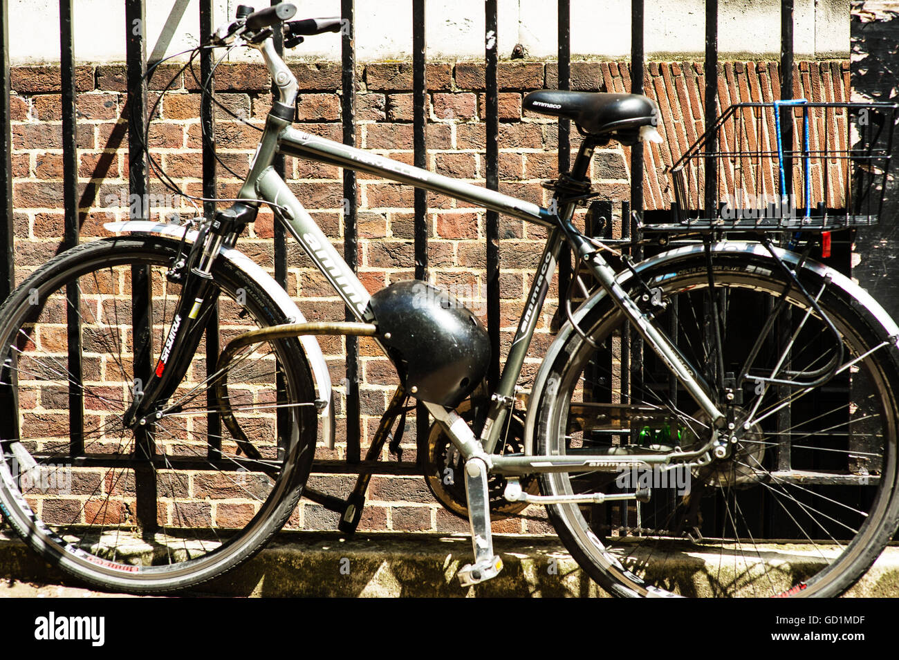 Bicycle chained railing hi-res stock photography and images - Alamy