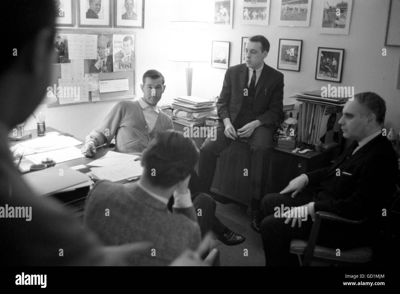 Johnny Carson meets with his staff in his office, on the set of the ...