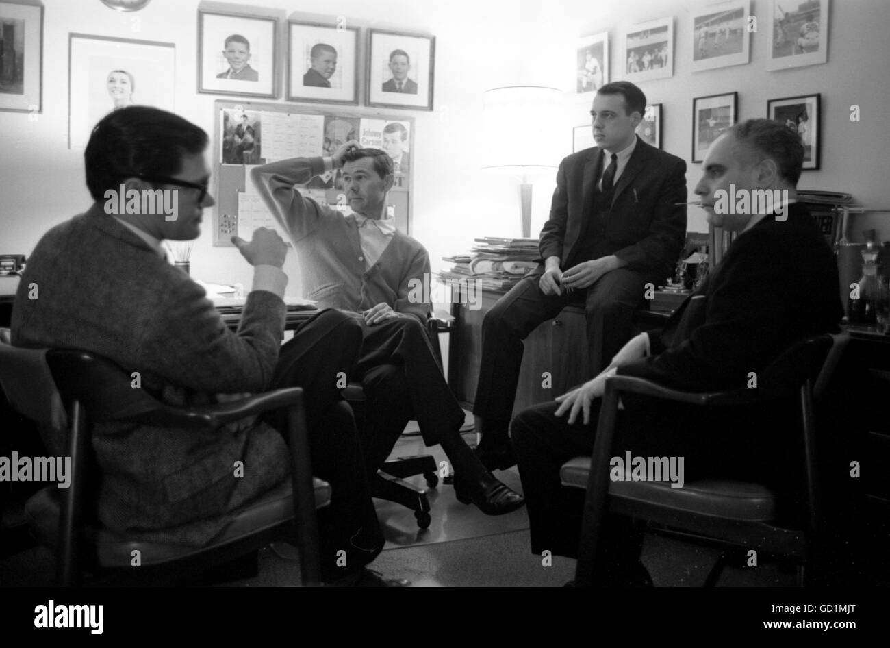 Johnny Carson meets with his staff in his office, on the set of the ...