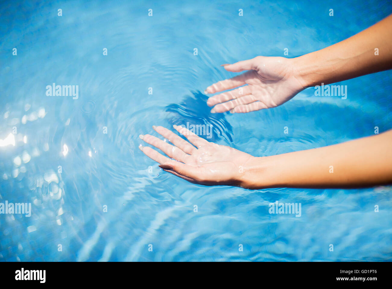 Hands in a pool; Island of Hawaii, Hawaii, United States of America ...