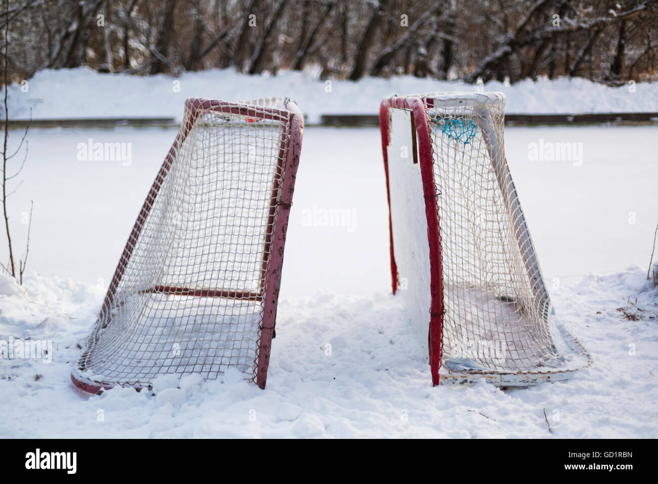 Two hockey nets in the snow beside a frozen outdoor rink; Wetaskiwin ...