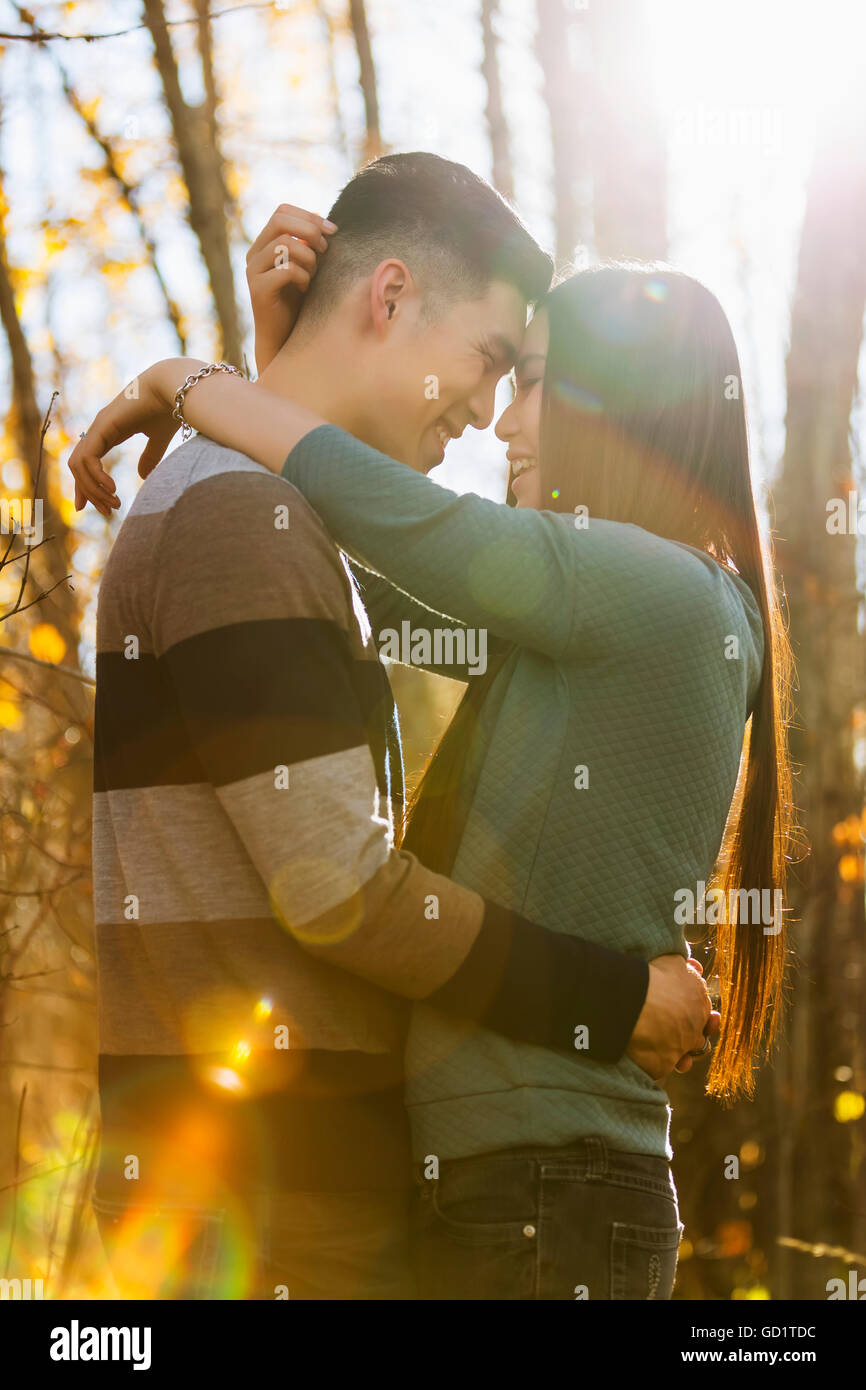 A Young Asian Couple Enjoying A Romantic Time Together Outdoors In A ...