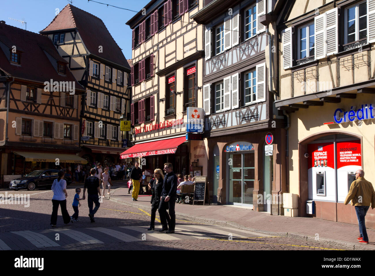 Visitors stroll through the charming Alsatian village of Obernai ...