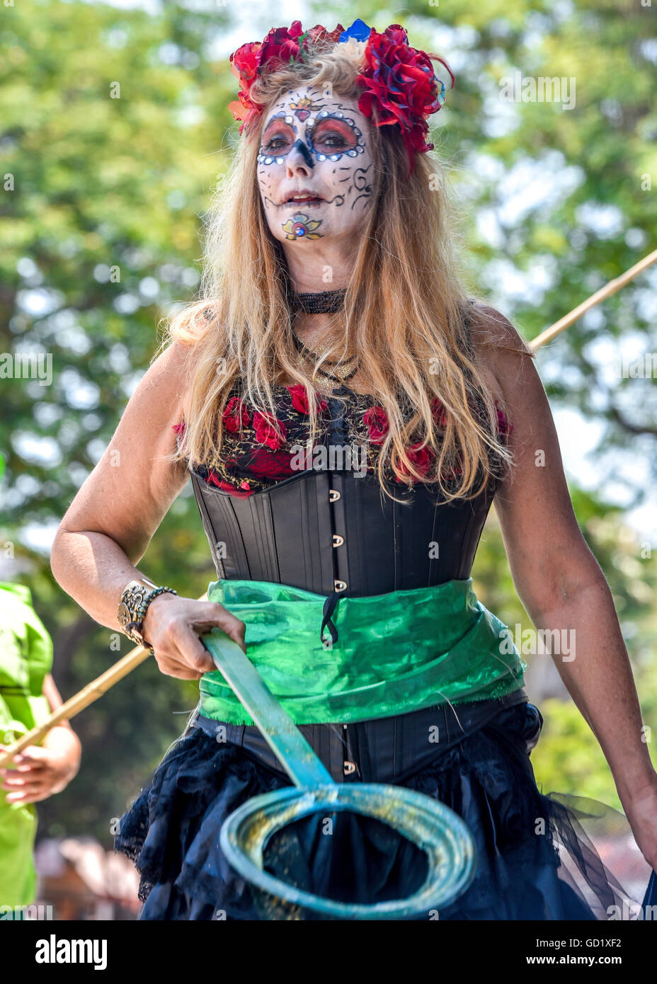 A woman with whimsical makeup and costume, at the yearly "Summer ...