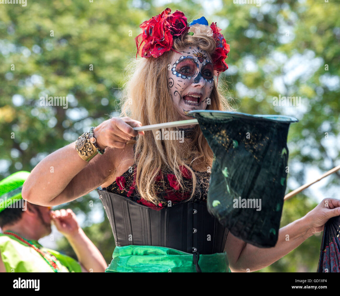 A woman with whimsical makeup and costume, at the yearly "Summer ...